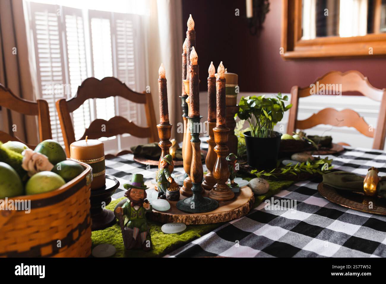 Rustic dining table setup with candles and decor Stock Photo - Alamy