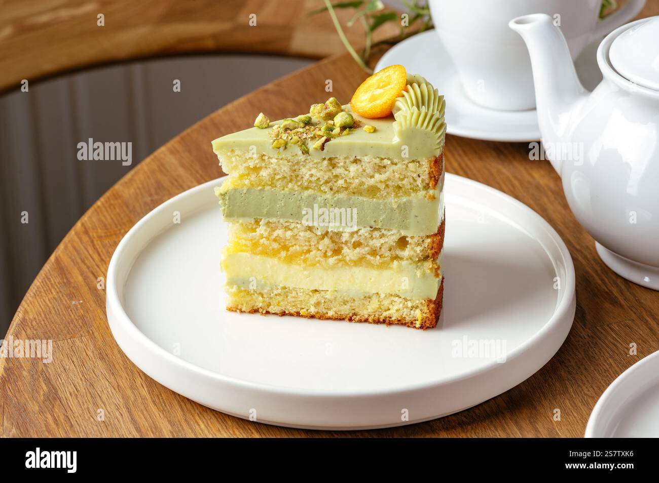 sponge cake with pistachio cream and citrus fruits Stock Photo - Alamy