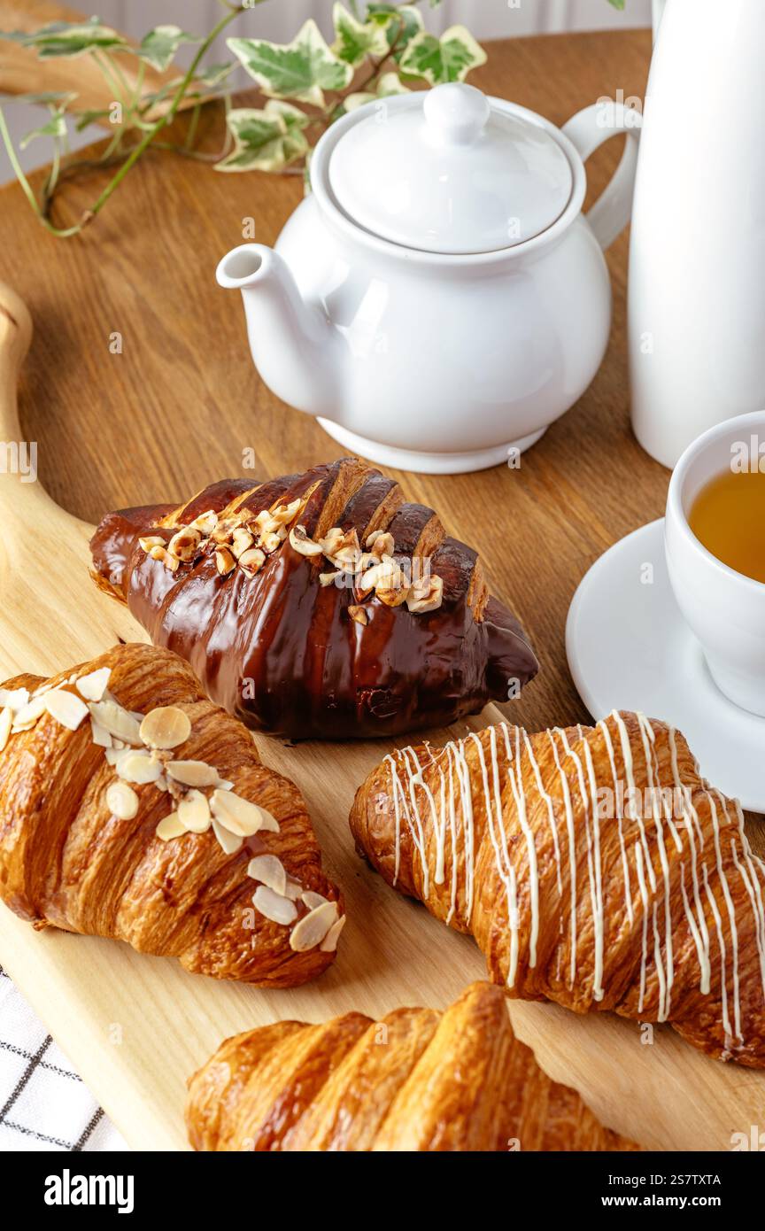 croissants on a board with tea Stock Photo - Alamy