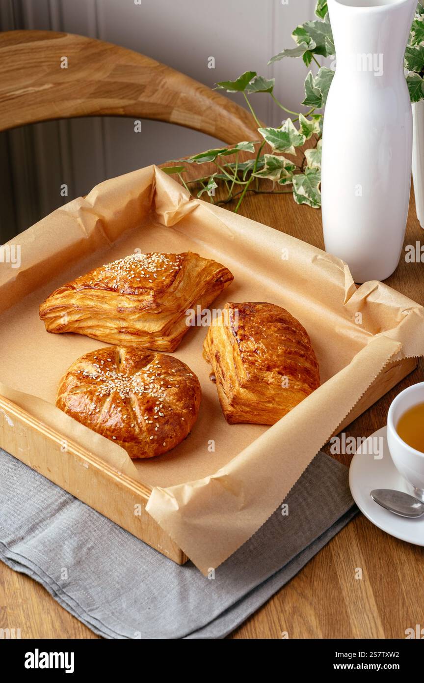 puff pastry buns on a tray Stock Photo - Alamy