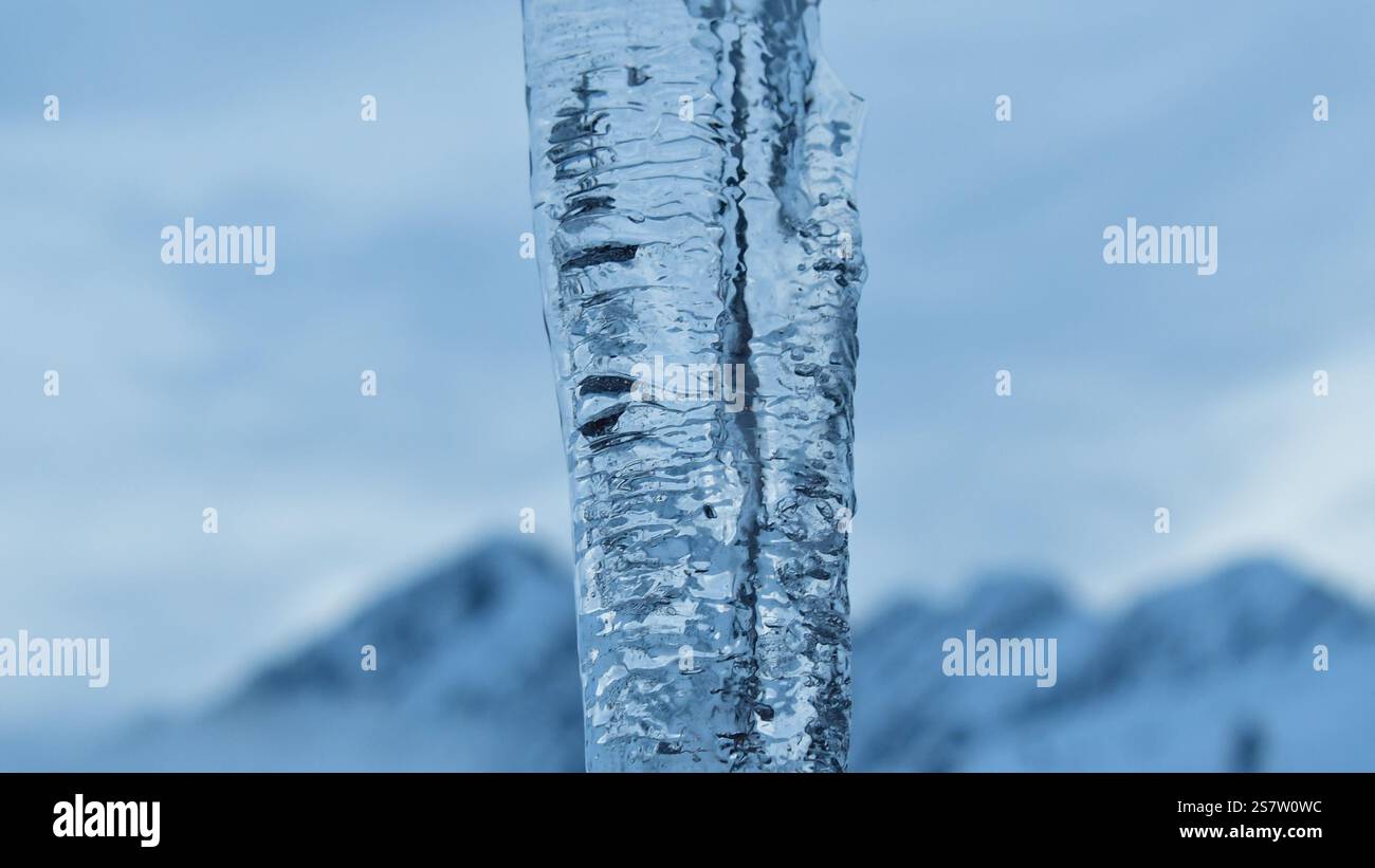the ice of a hanging icicle Stock Photo - Alamy
