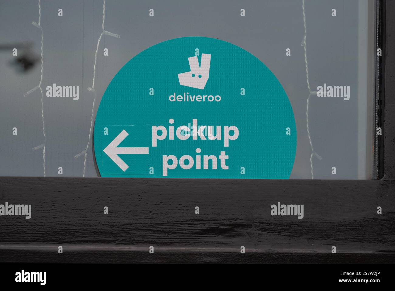 Deliveroo pick up point sign on the window of a restaurant. January ...
