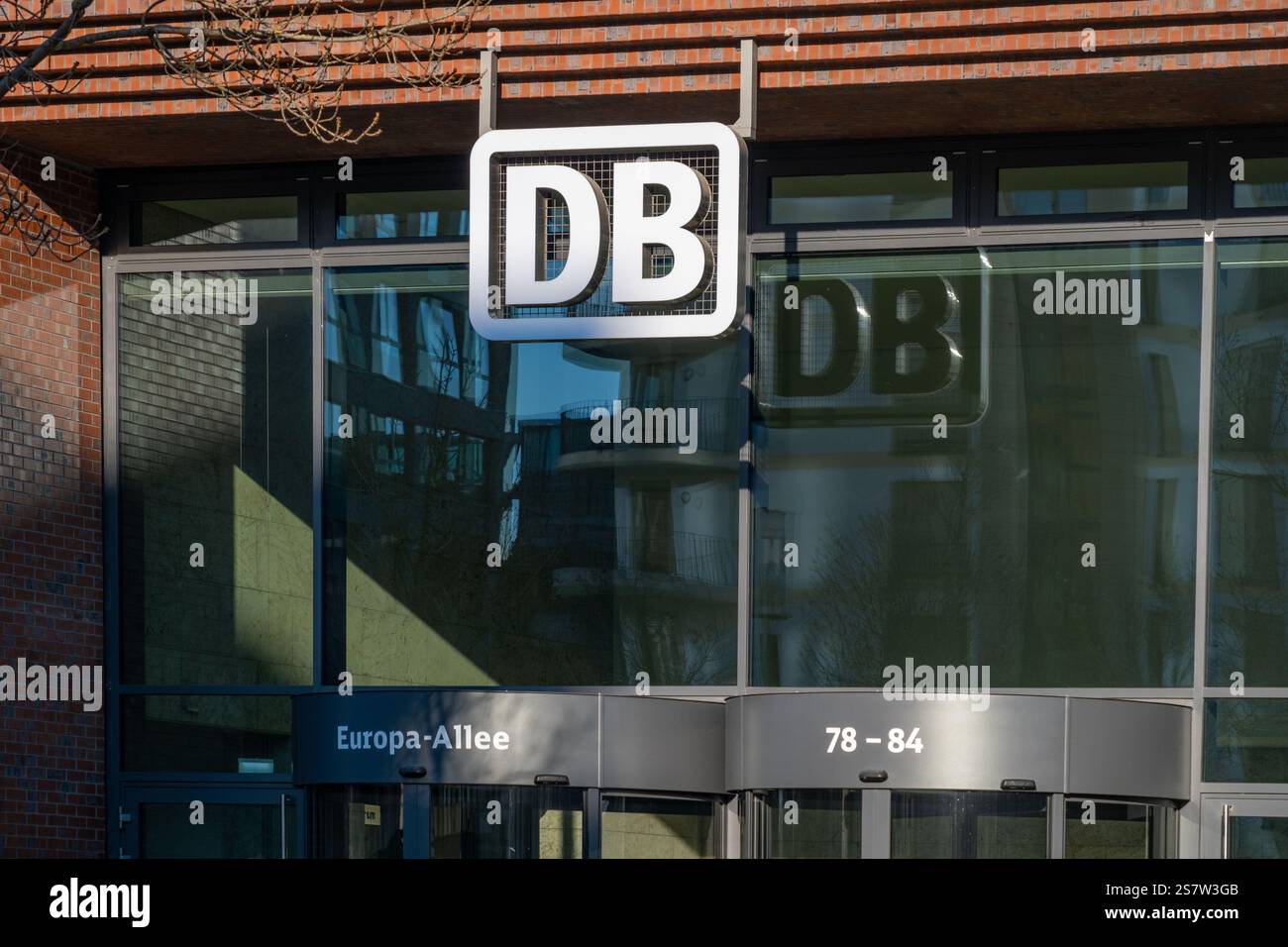 modern building with prominent iconic DB logo against blue sky ...