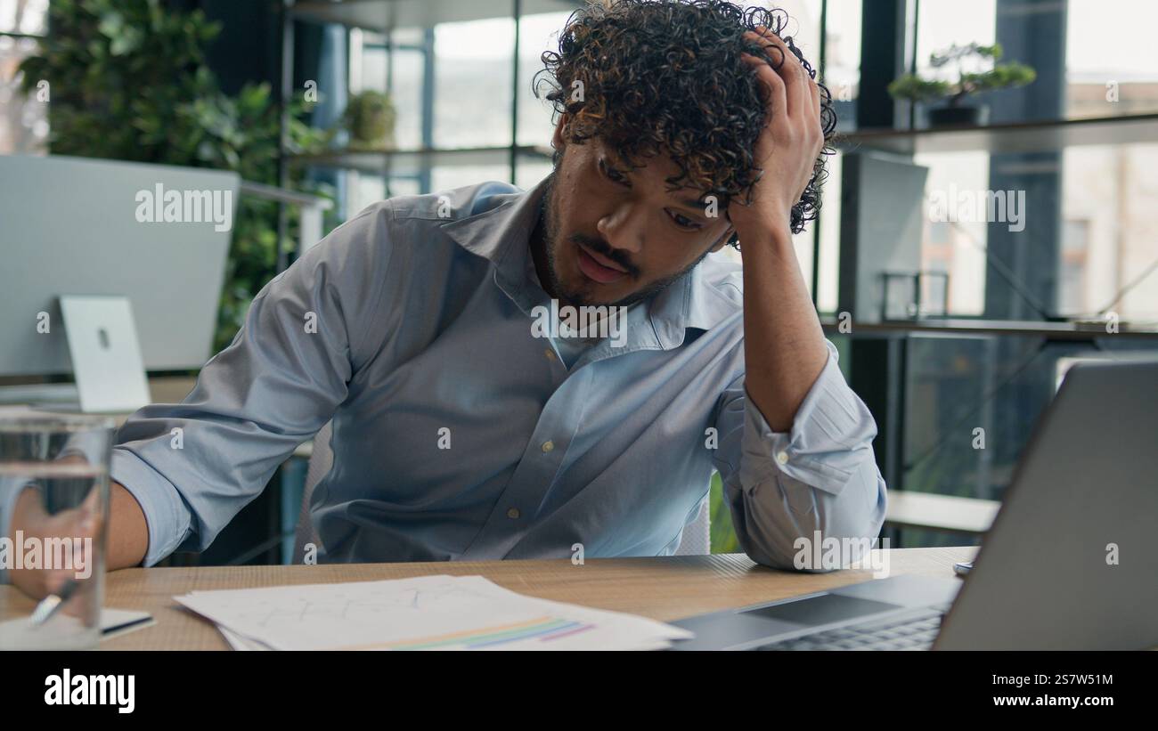 Frustrated Indian business man Arabian businessman at office desk ...