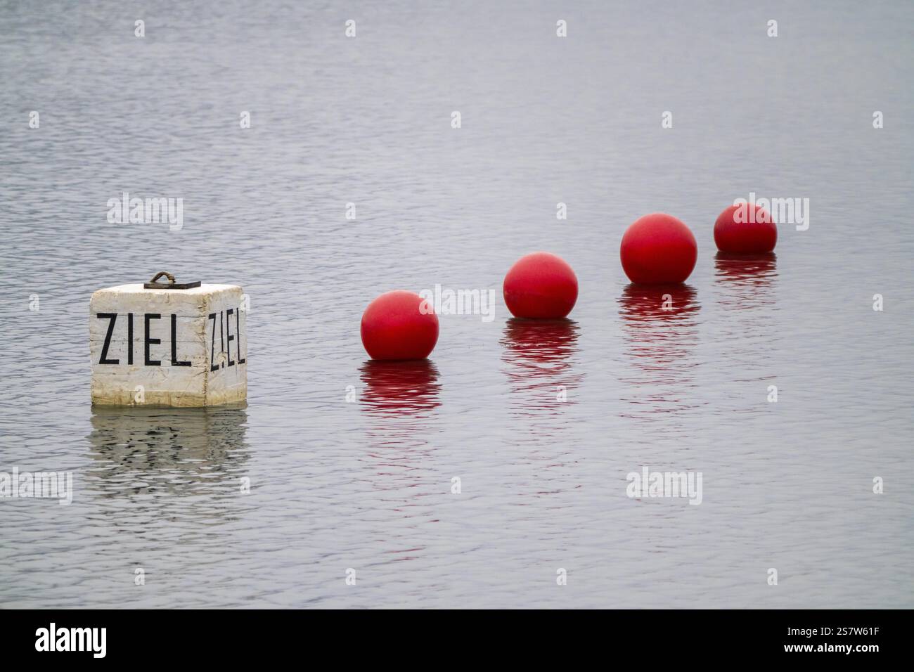 Target buoy on a lake, red marker buoys for water sports, regattas ...