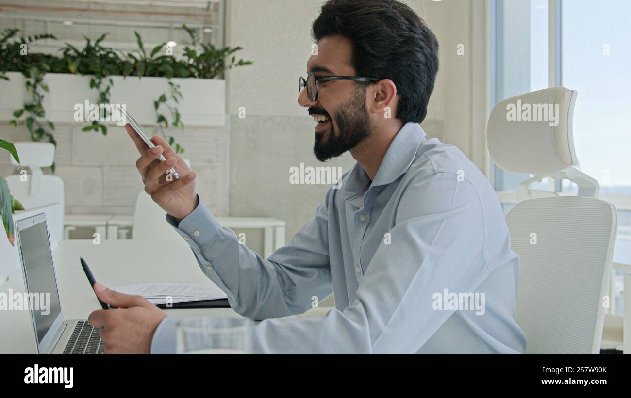 Successful arabian indian man multitasking hi-res stock photography and ...