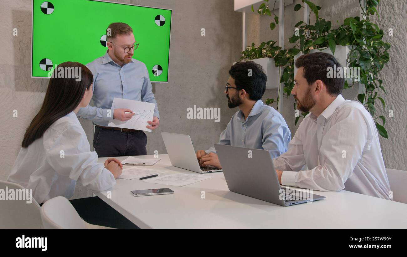 Office conference meeting with green chroma key screen male CEO leader ...