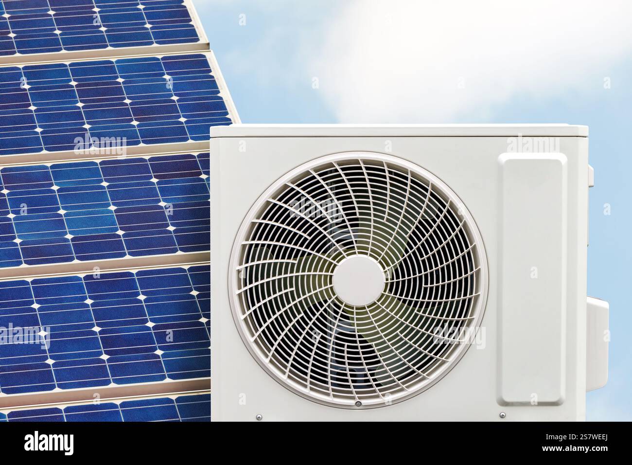 Air-source heat pump with solar panel in front of a blue sky Stock ...