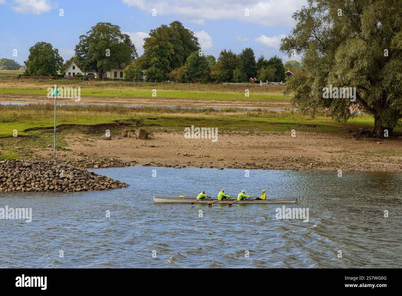 Dutch countryside, group of people rowing in the stream Stock Photo - Alamy