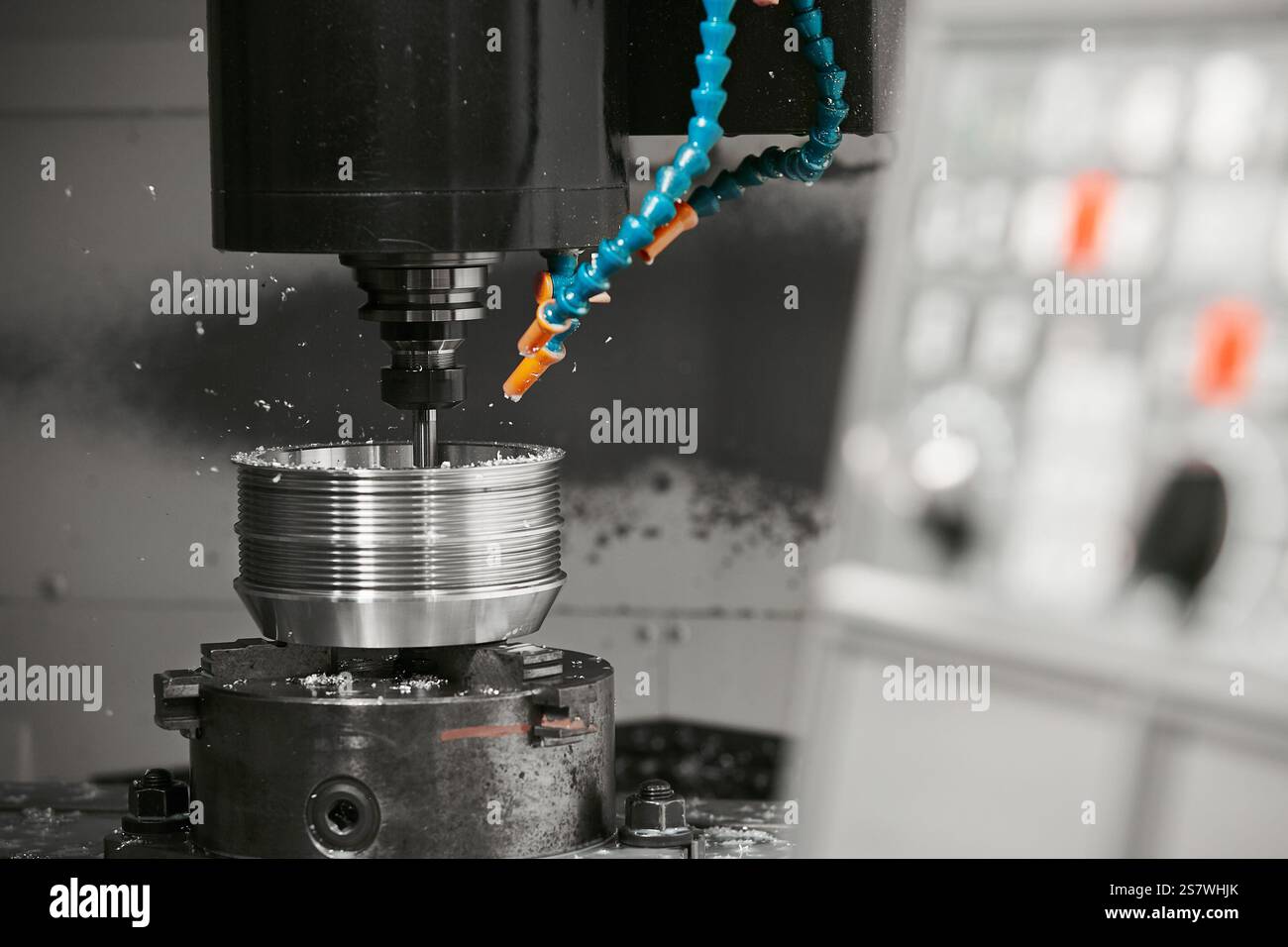 CNC milling machine cutting aluminium automotive part with a coolant ...