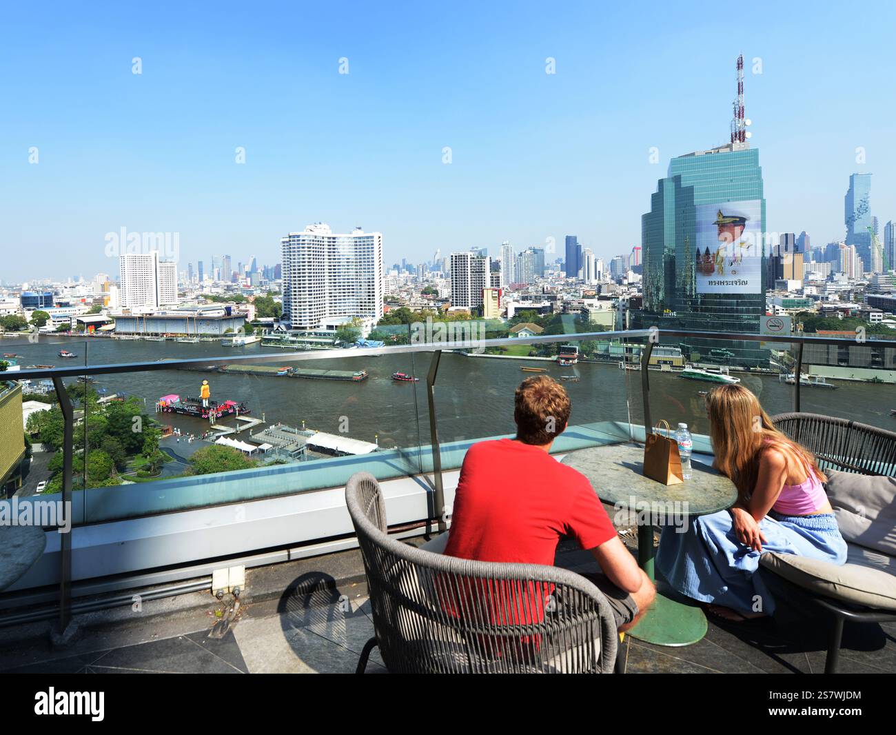 Tourist enjoying the city views from the large balcony at the top of ...