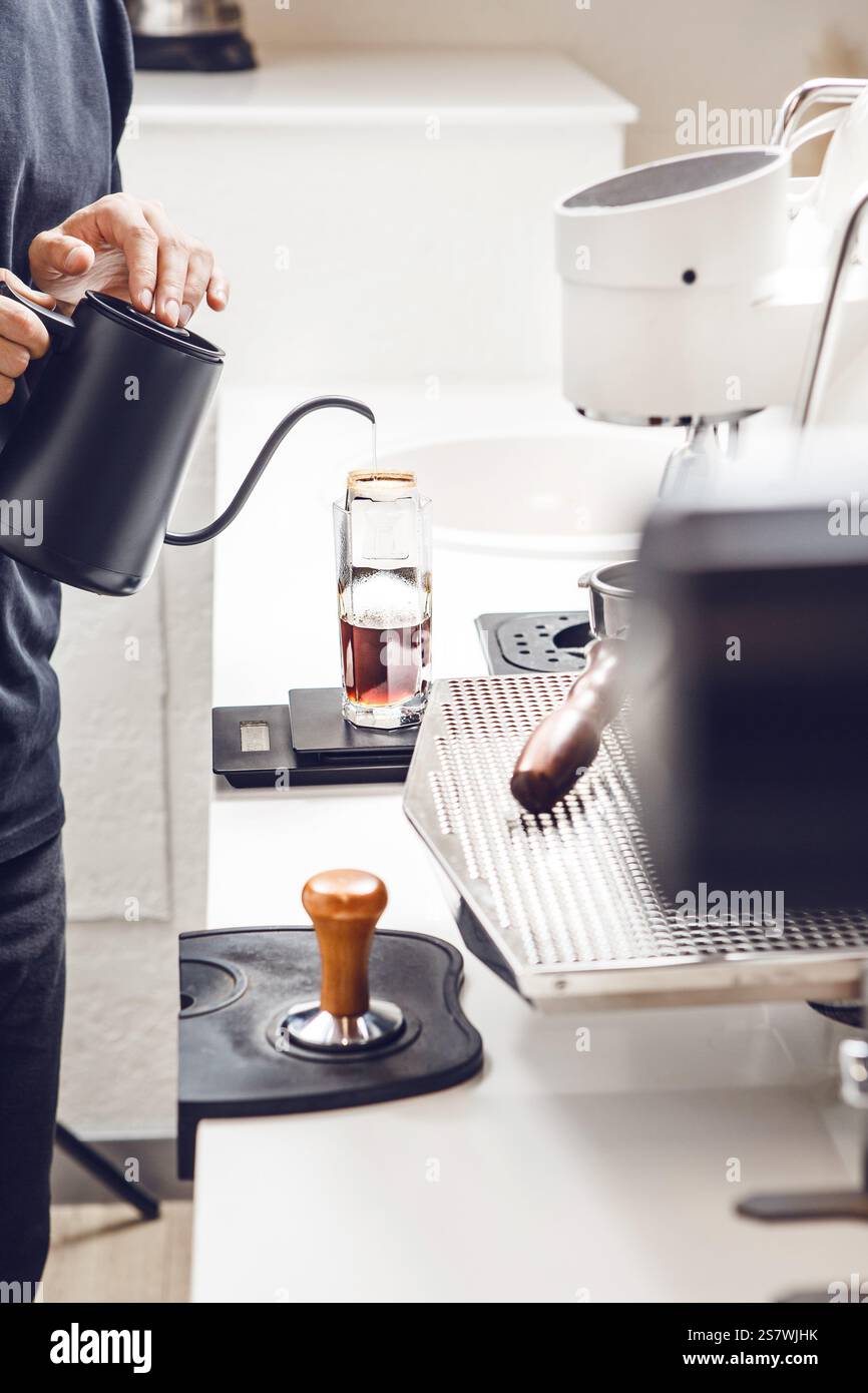 Barista Brews Coffee Using Drip Bag Method While Pouring Hot Water From ...