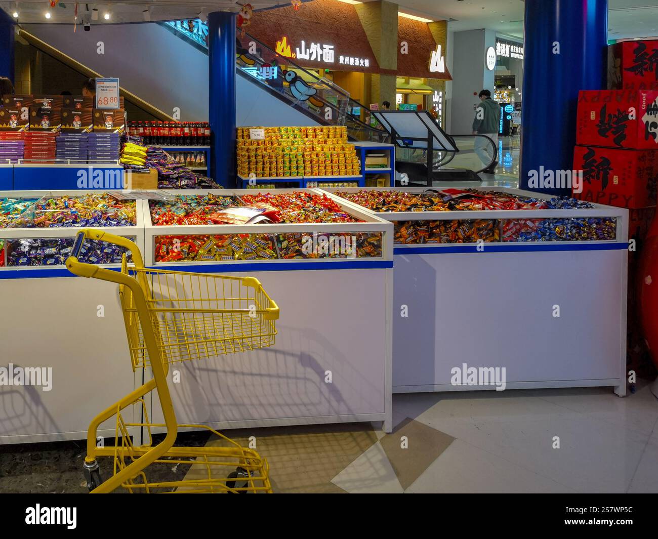 ShenZhen, China - January 20, 2025 : A yellow shopping cart sits near ...