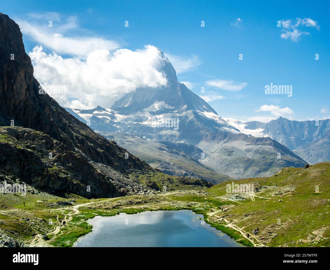 Amazing view of Riffelsee lake near Matterhorn peak mountain, tourist ...