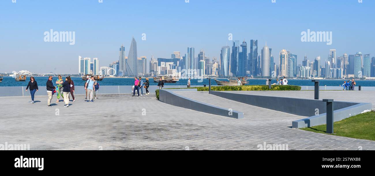 Doha, Qatar - January 4, 2025: Crowds revel in the sun along the ...