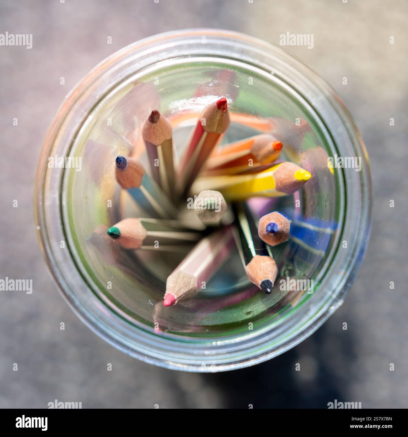 Colored pencils in a glass Stock Photo - Alamy