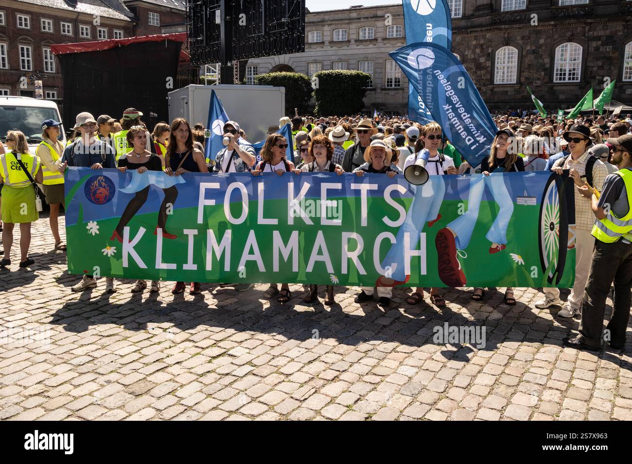 Protesters hold flags and a banner during the ’Folkets Klimamarch. The ...