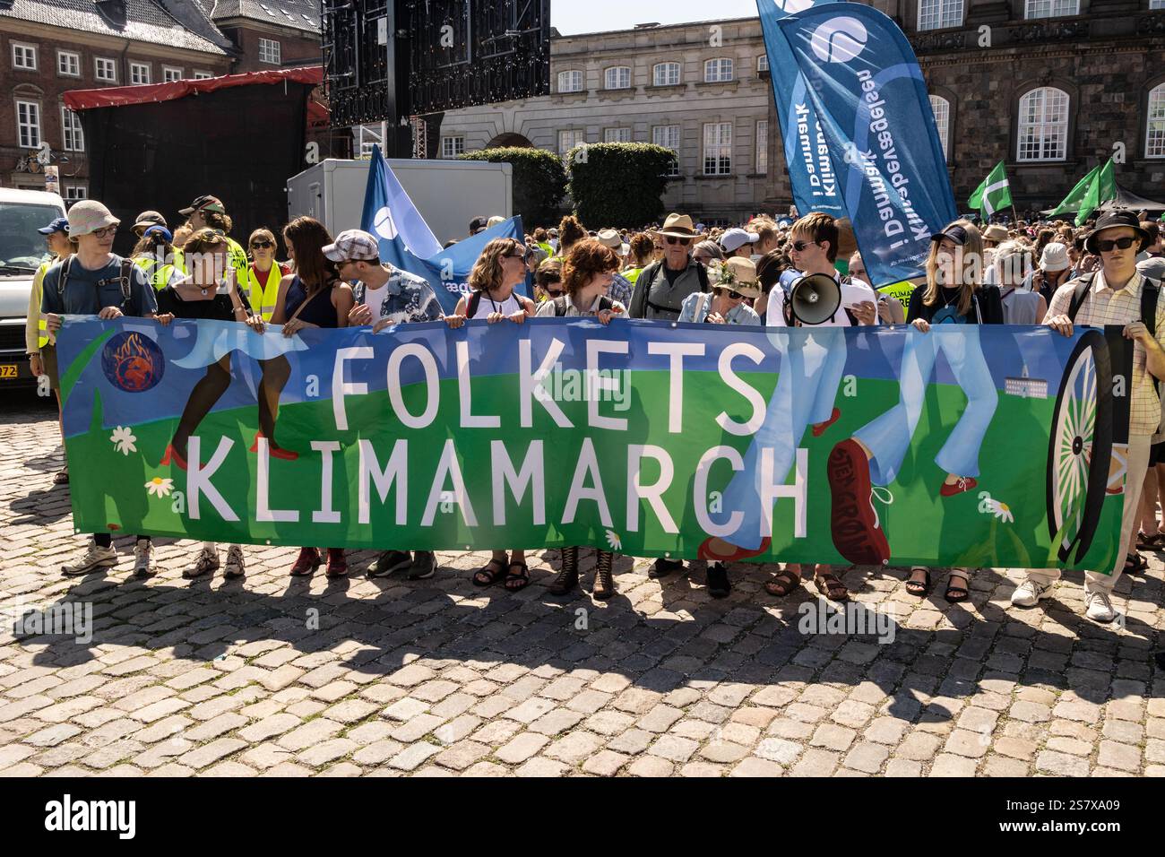 Protesters hold flags and a banner during the ’Folkets Klimamarch. The ...