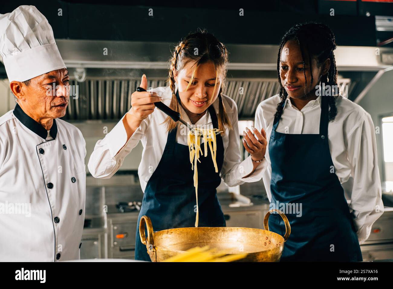 In kitchen chef trains students. Schoolgirls make ramen. Kids and ...