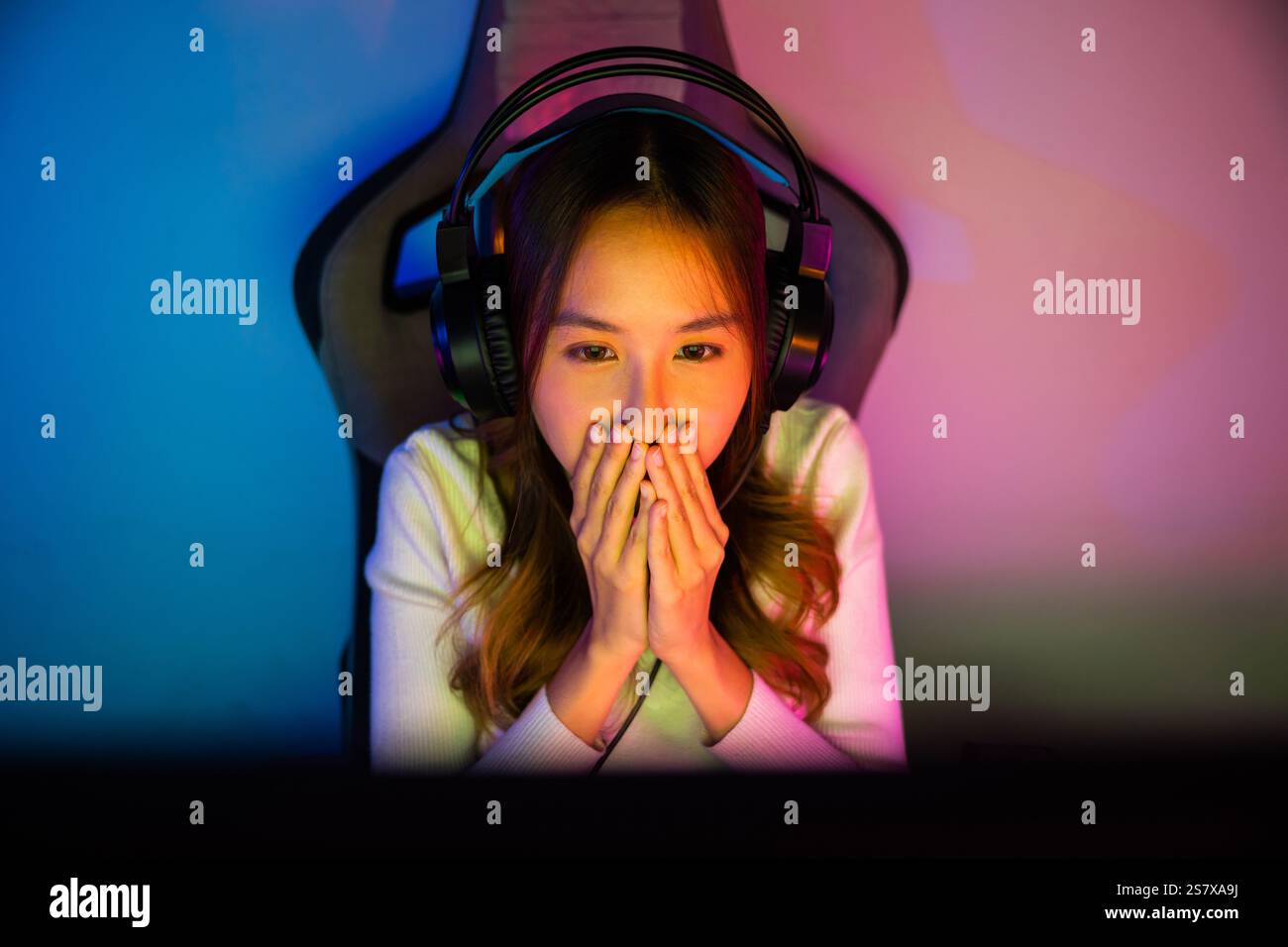 Asian happy Gamer endeavor plays online video games tournament with ...