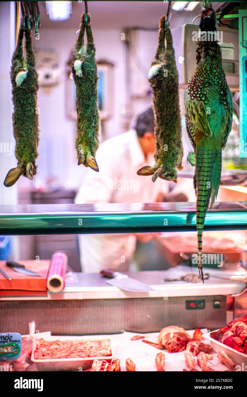 Hanging game animals in a butcher shop with a traditional and rustic ...