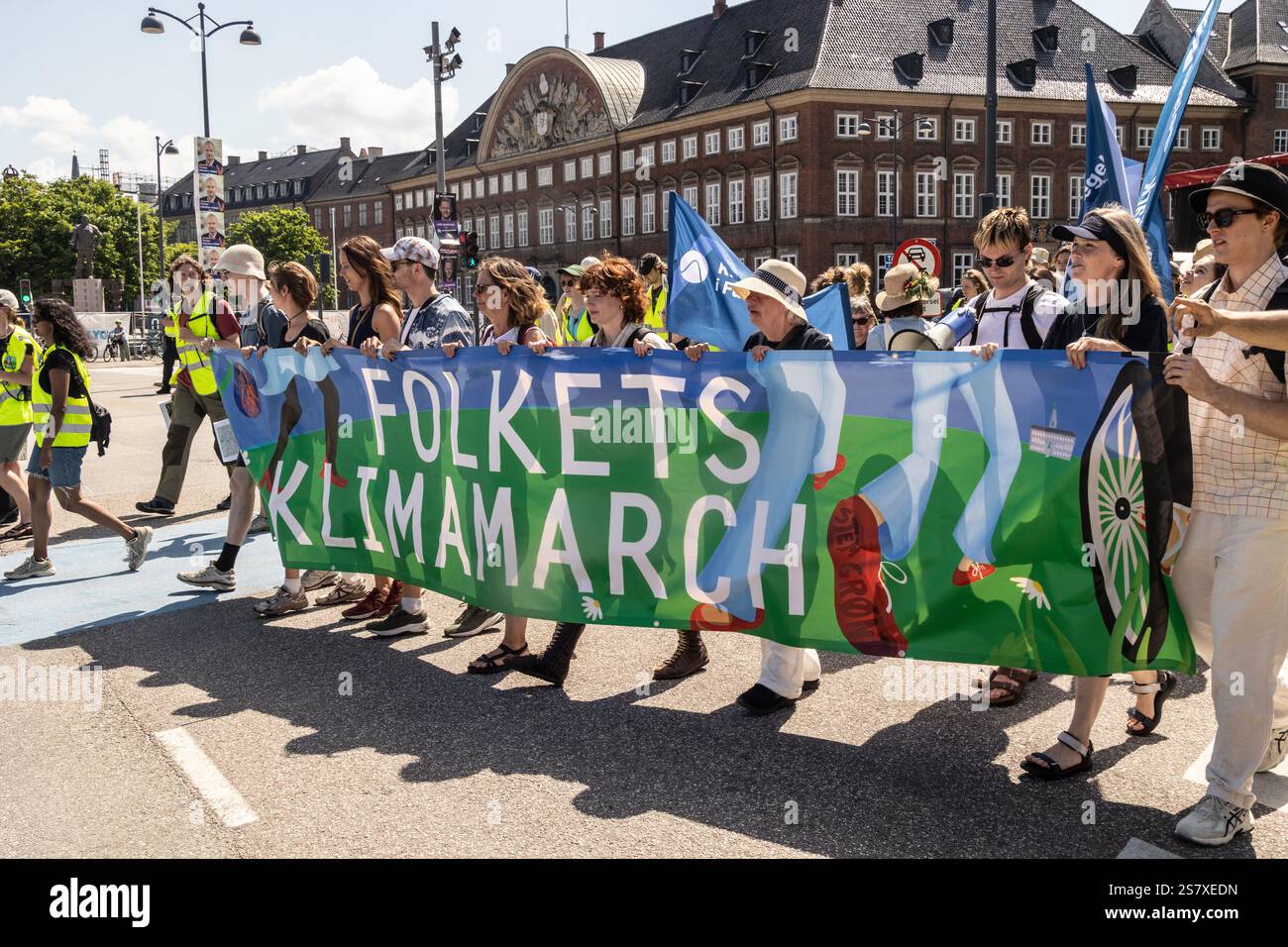 June 2, 2024, Copenhagen, Denmark: Protesters hold flags and a banner ...