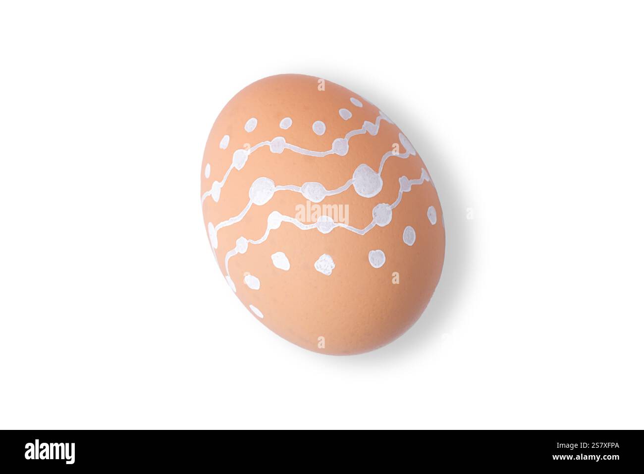One Easter egg is a natural beige color with a minimalistic white ...