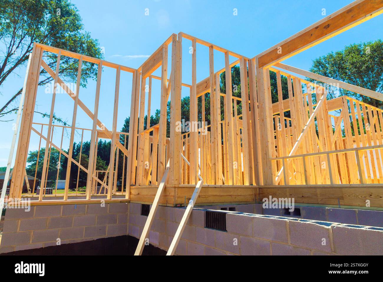 New construction project wooden framing beams process with walls ...