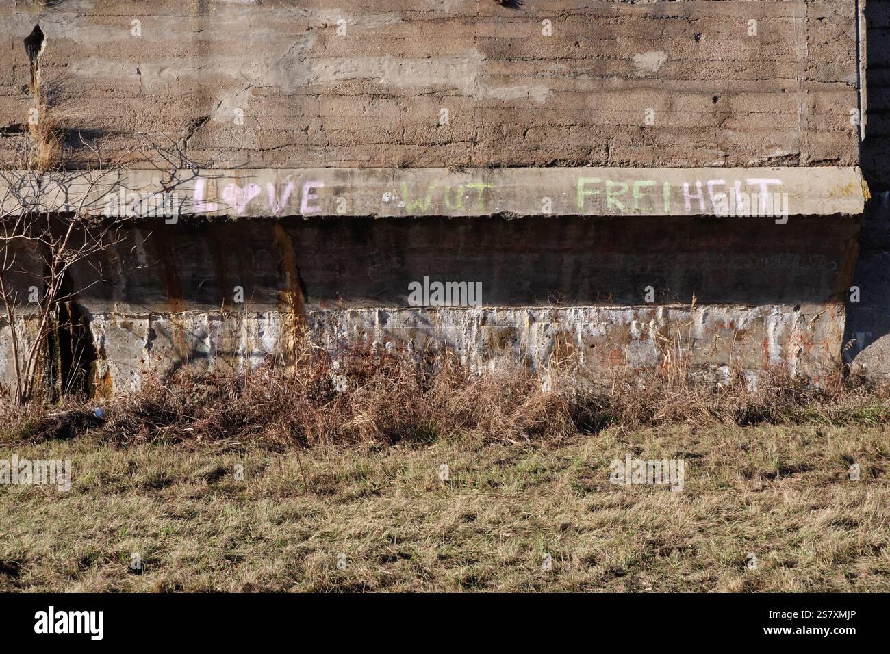 Love, Anger Freedom, (love wut freiheit) graffiti on a ruined road ...