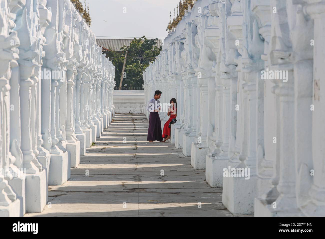 Mandalay, Myanmar: Kuthodaw Pagoda, Tripitaka tablets, Burmese couple ...
