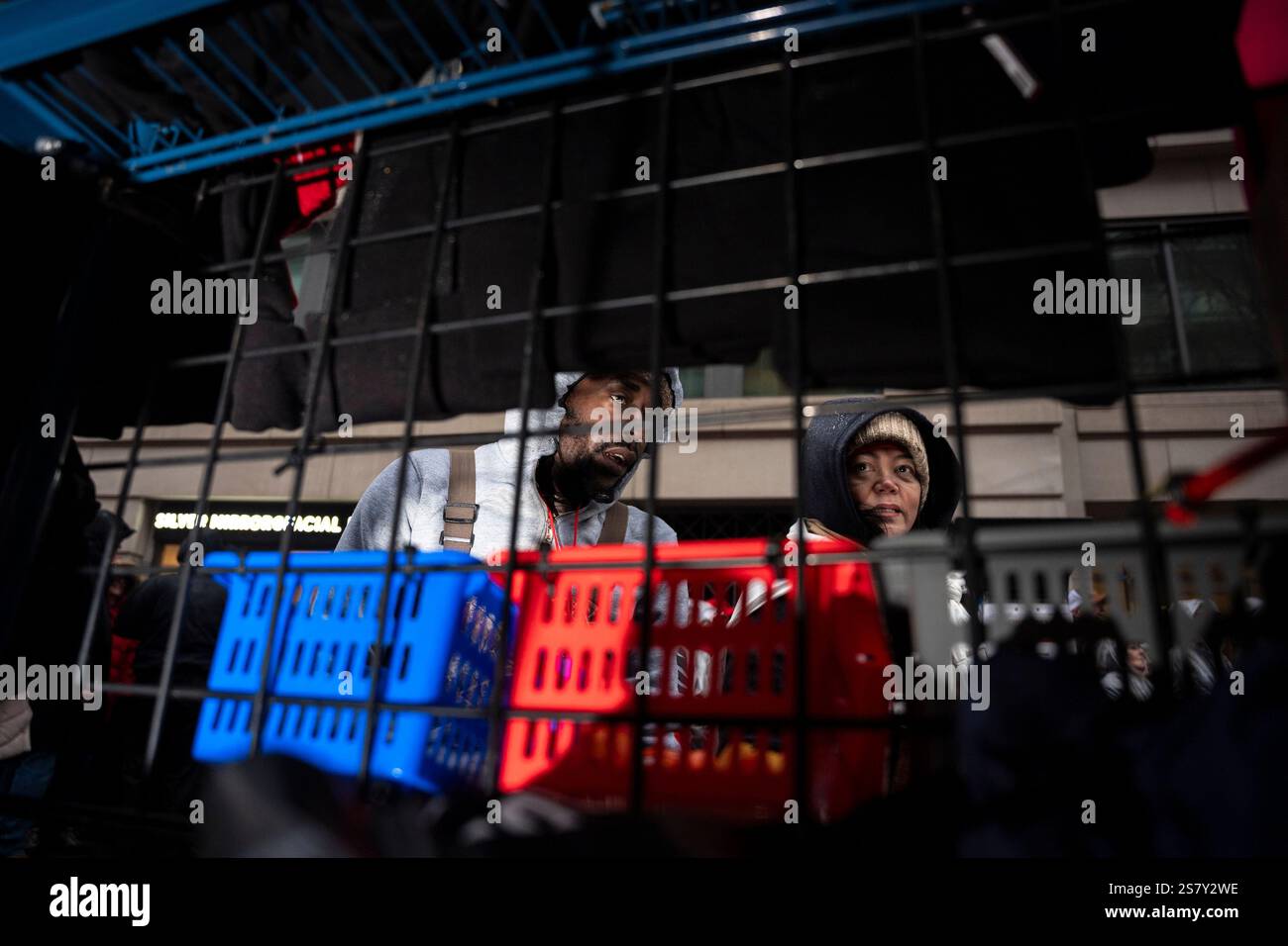 People shop for Trump merchandise while waiting outside of Capitol One ...