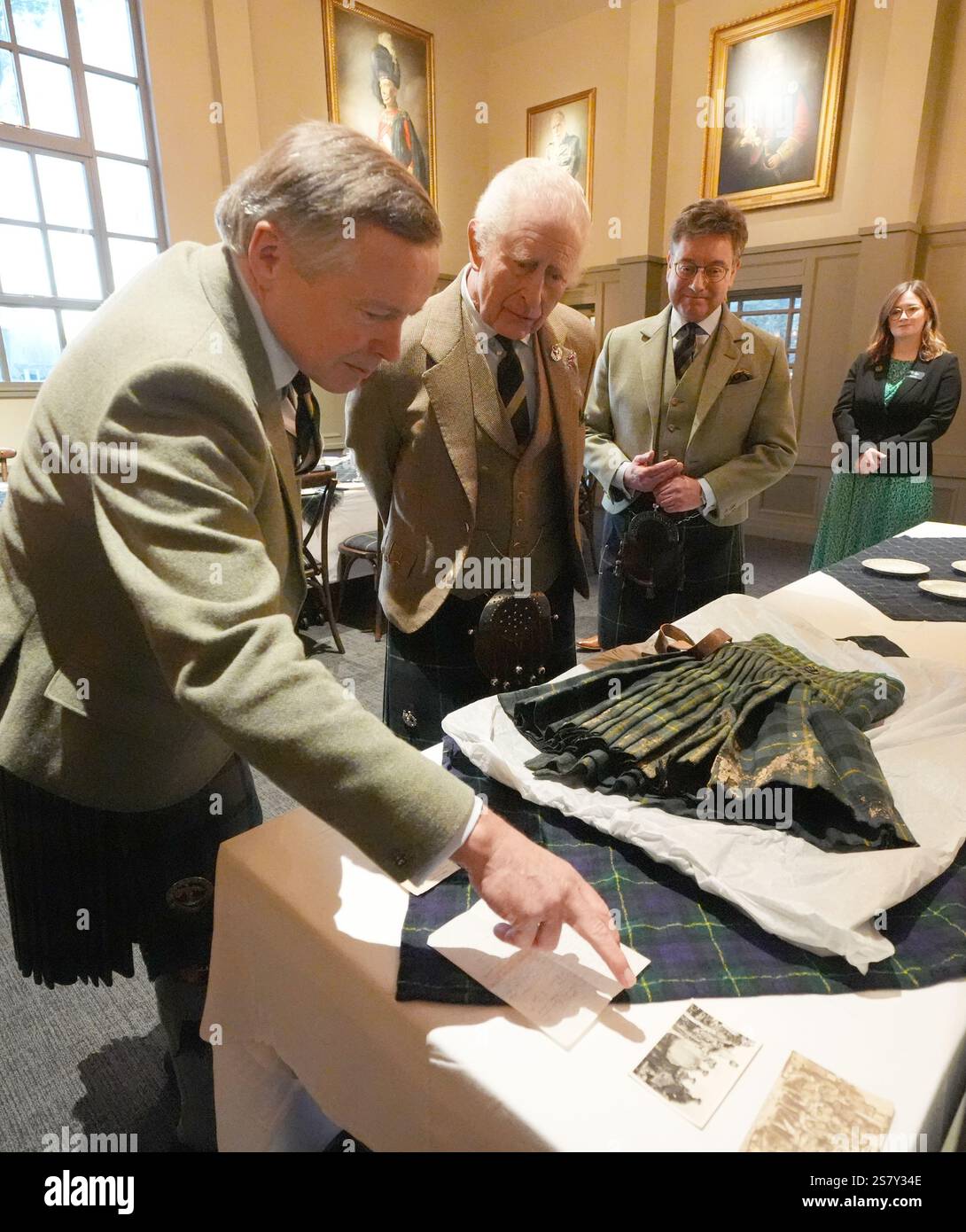 King Charles III meets Alexander 'Sandy' Manson (left) as they view a ...