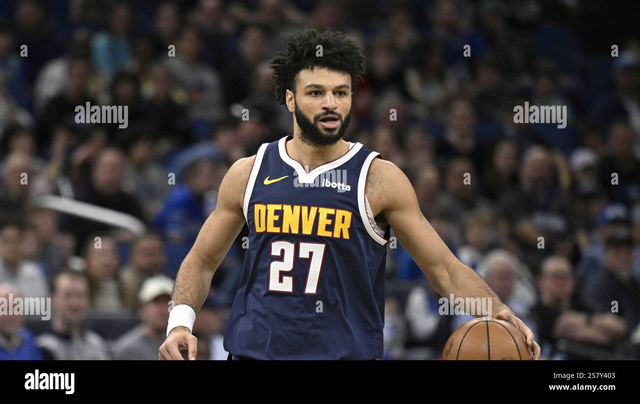 Denver Nuggets guard Jamal Murray (27) brings the ball up the court ...