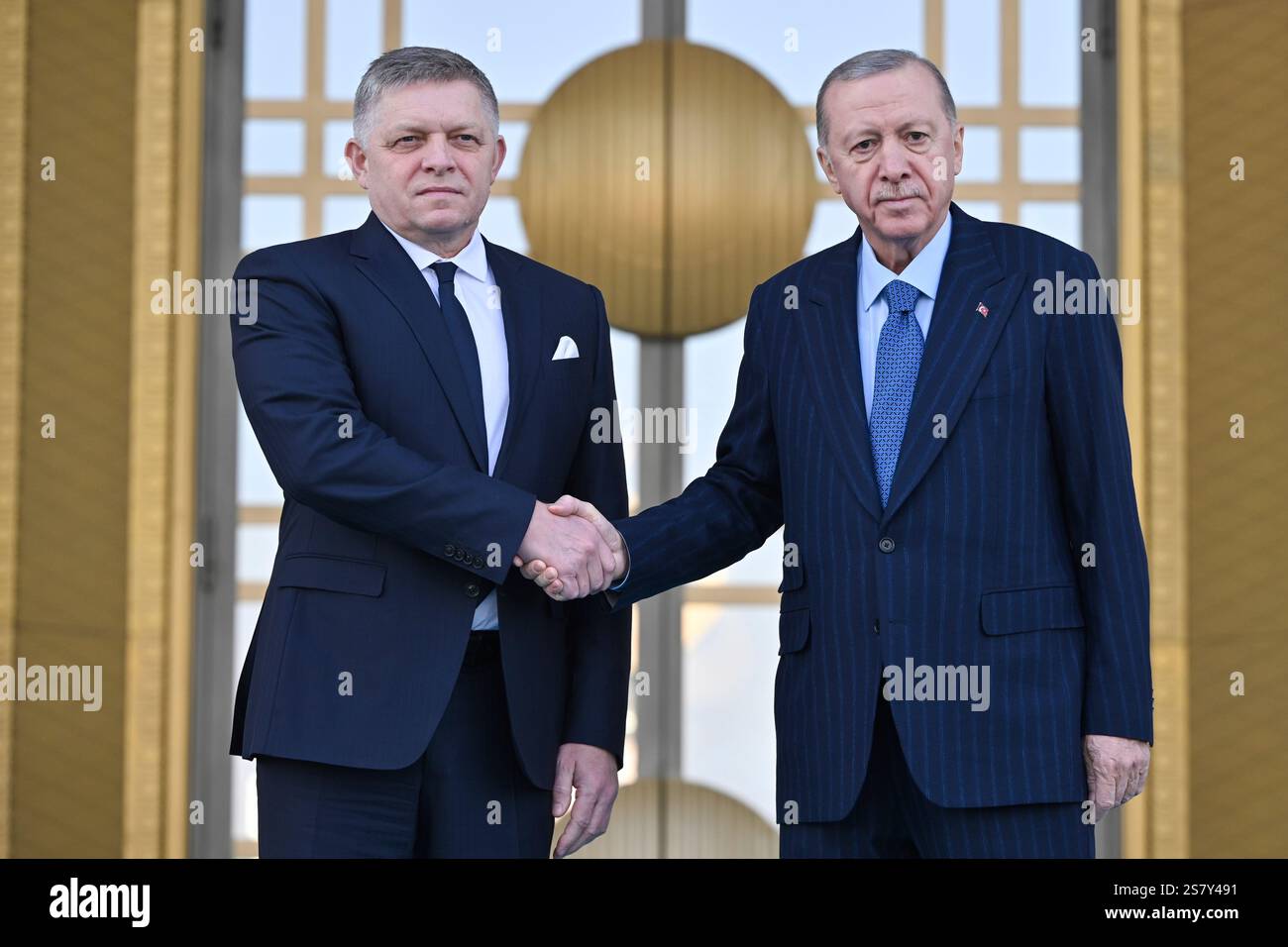 Turkey's President Recep Tayyip Erdogan, right, shakes hands with ...