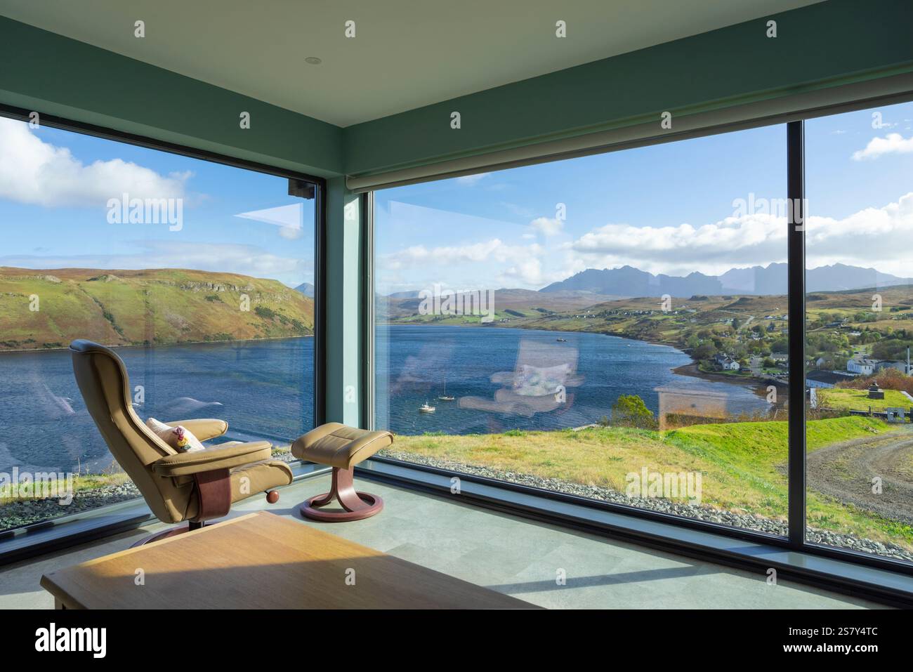View through a large bifold window to Loch Harport and Carbost on the ...