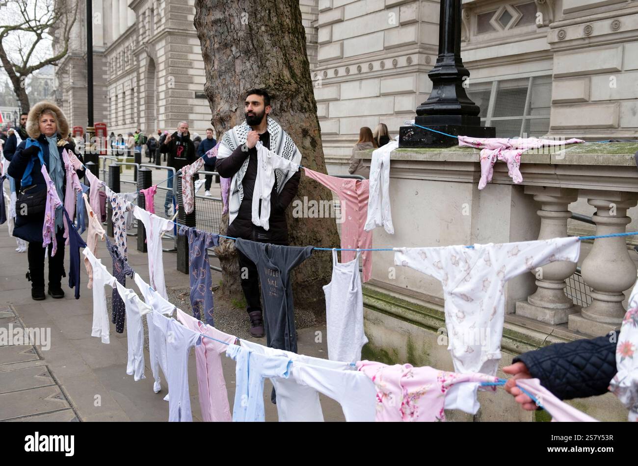 Protesters at Pro Palestine man baby clothes on line at Whitehall ...