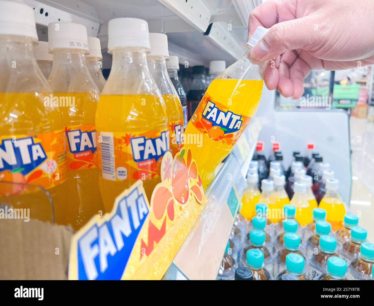 Fukuoka, Japan - January 20, 2025: Hand grabs Fanta Orange from ...