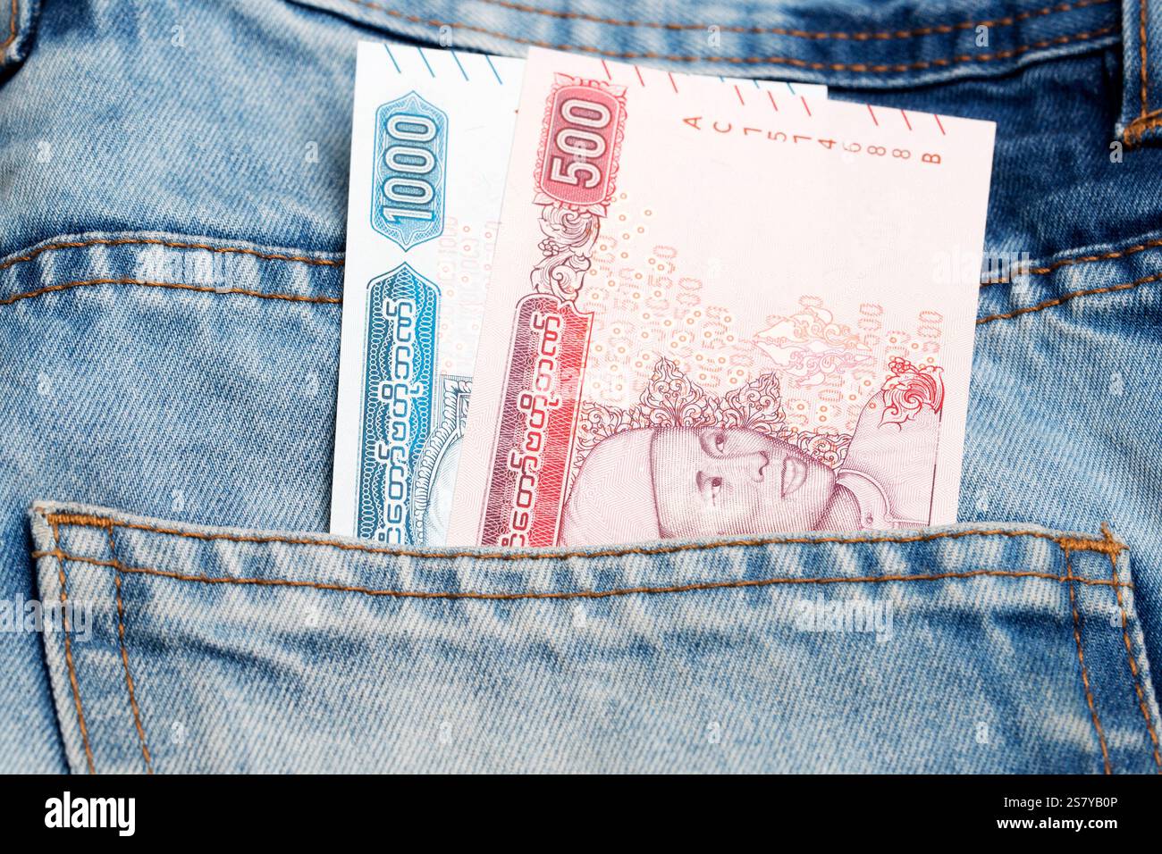 Myanmar money - kyat in the pocket of blue jeans Stock Photo - Alamy