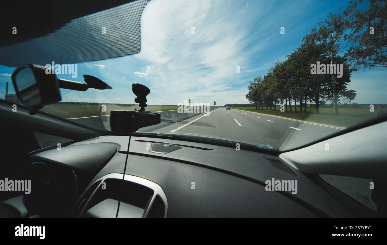 Dashboard camera capturing highway driving through windshield under ...
