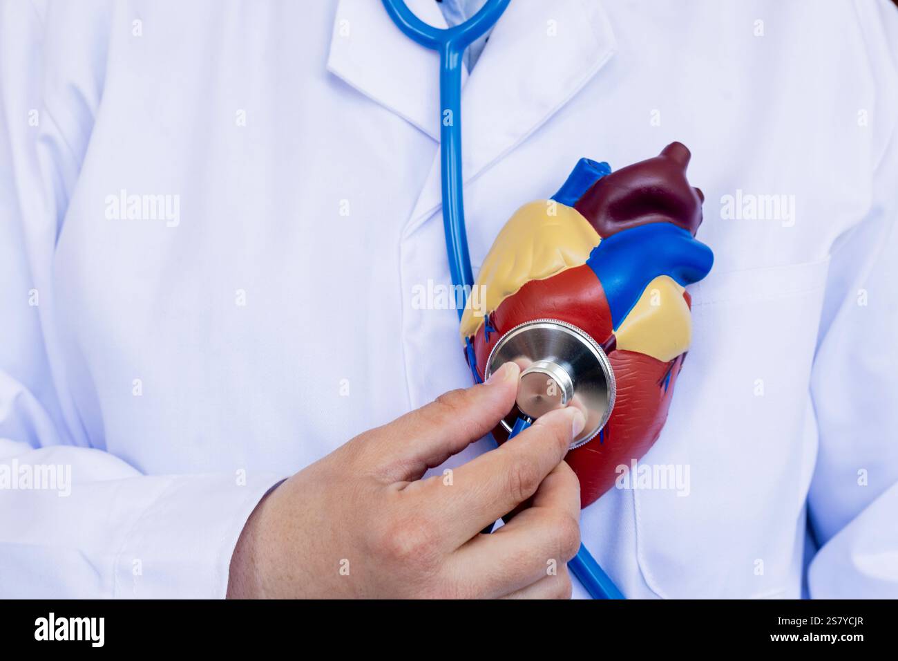 Close-up of a physician holding a stethoscope over a colorful ...