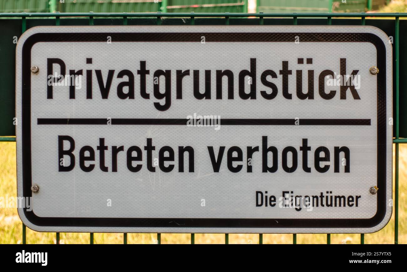 A sign in German that says Privategrundstuck Betreten Verboten. The ...
