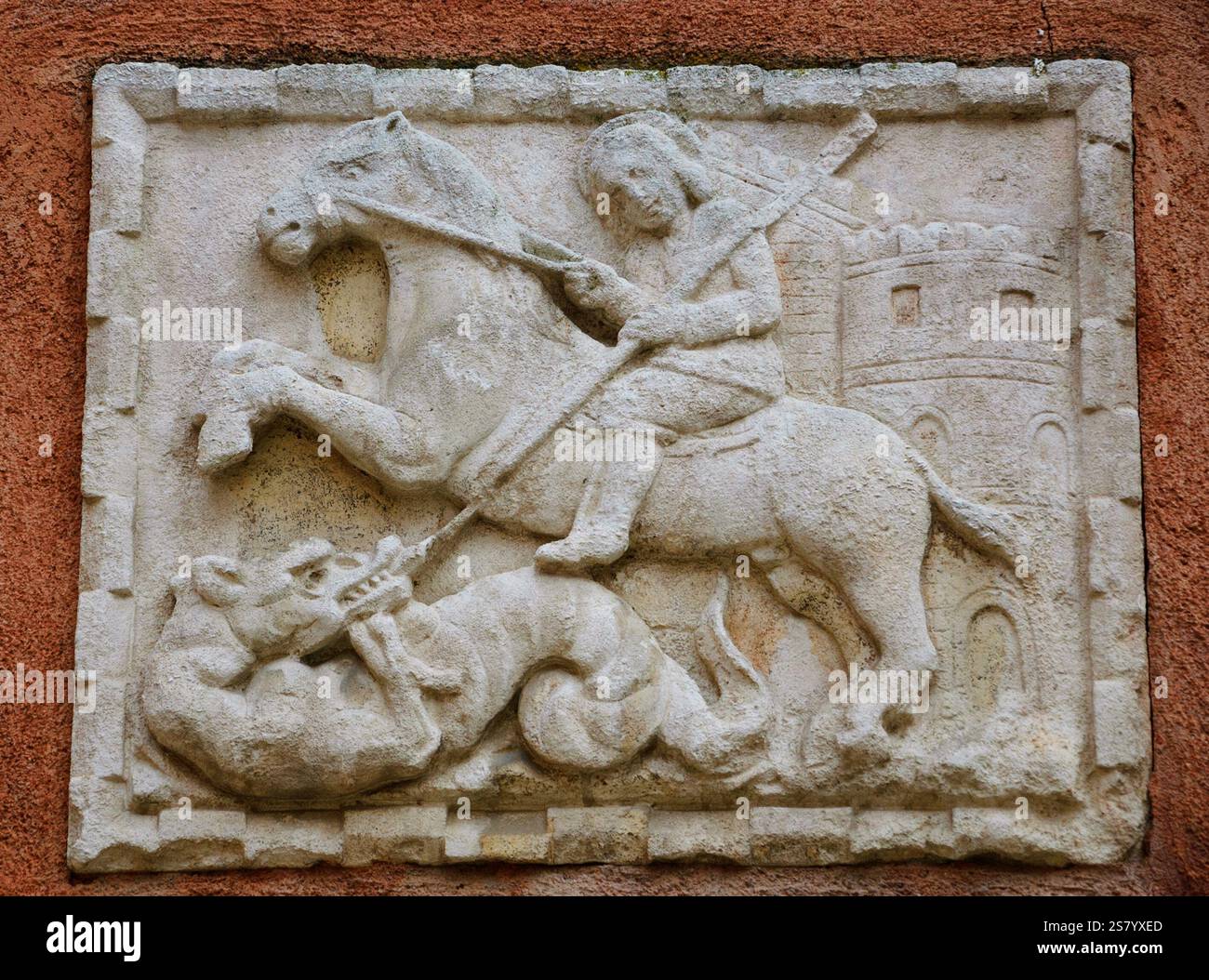 Saint George slaying the dragon. Architectural detail. Bas relief ...
