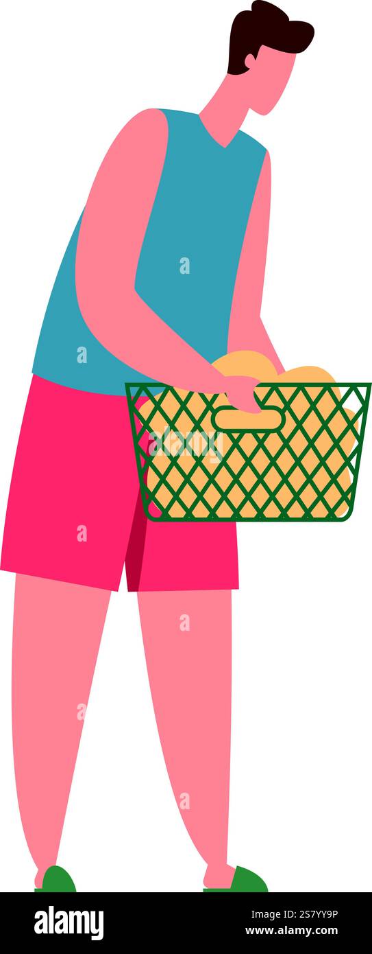 Young man carrying a laundry basket filled with neatly folded clothes ...