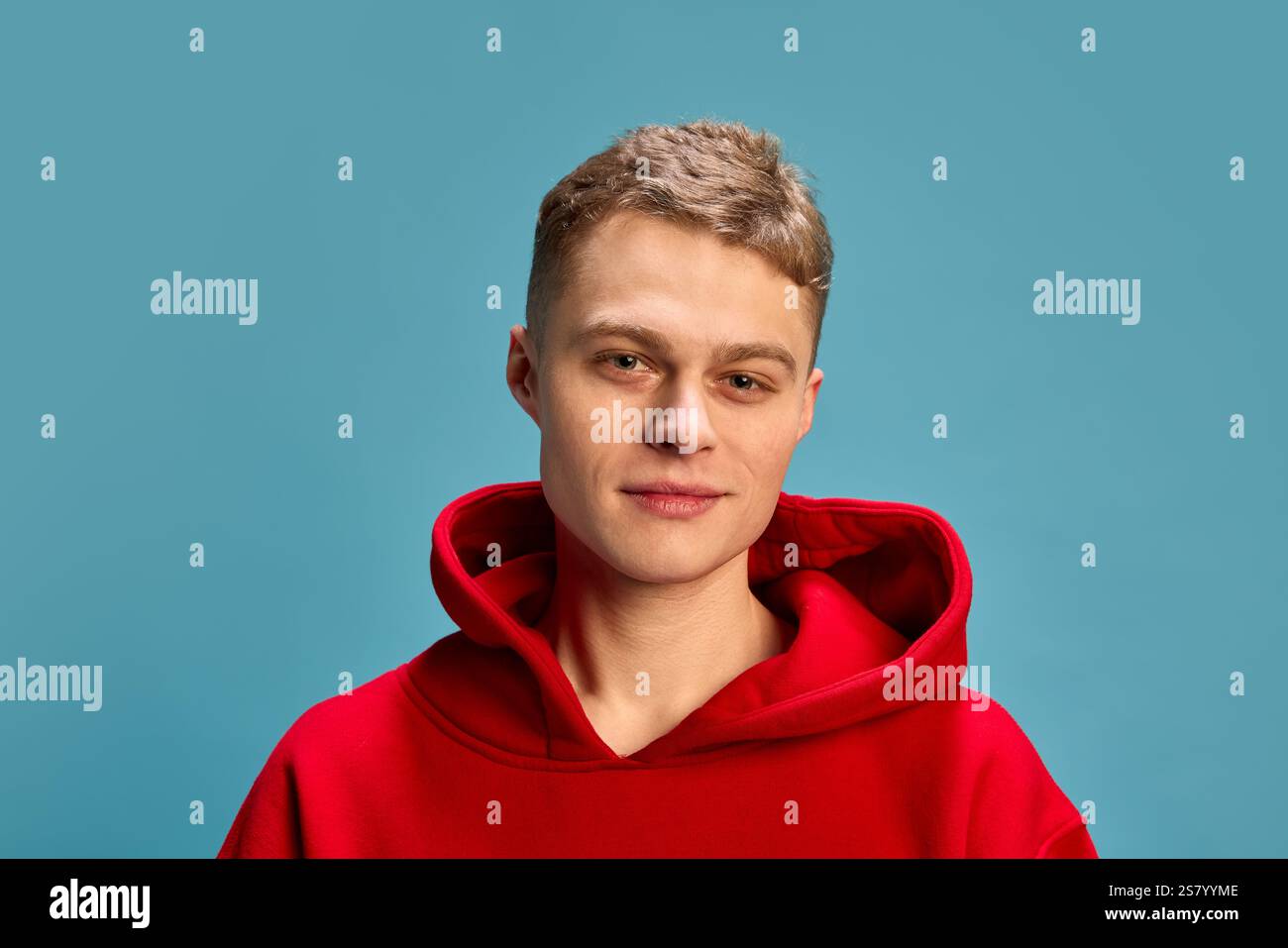 Portrait of young attractive man, dressed casually, with calm ...