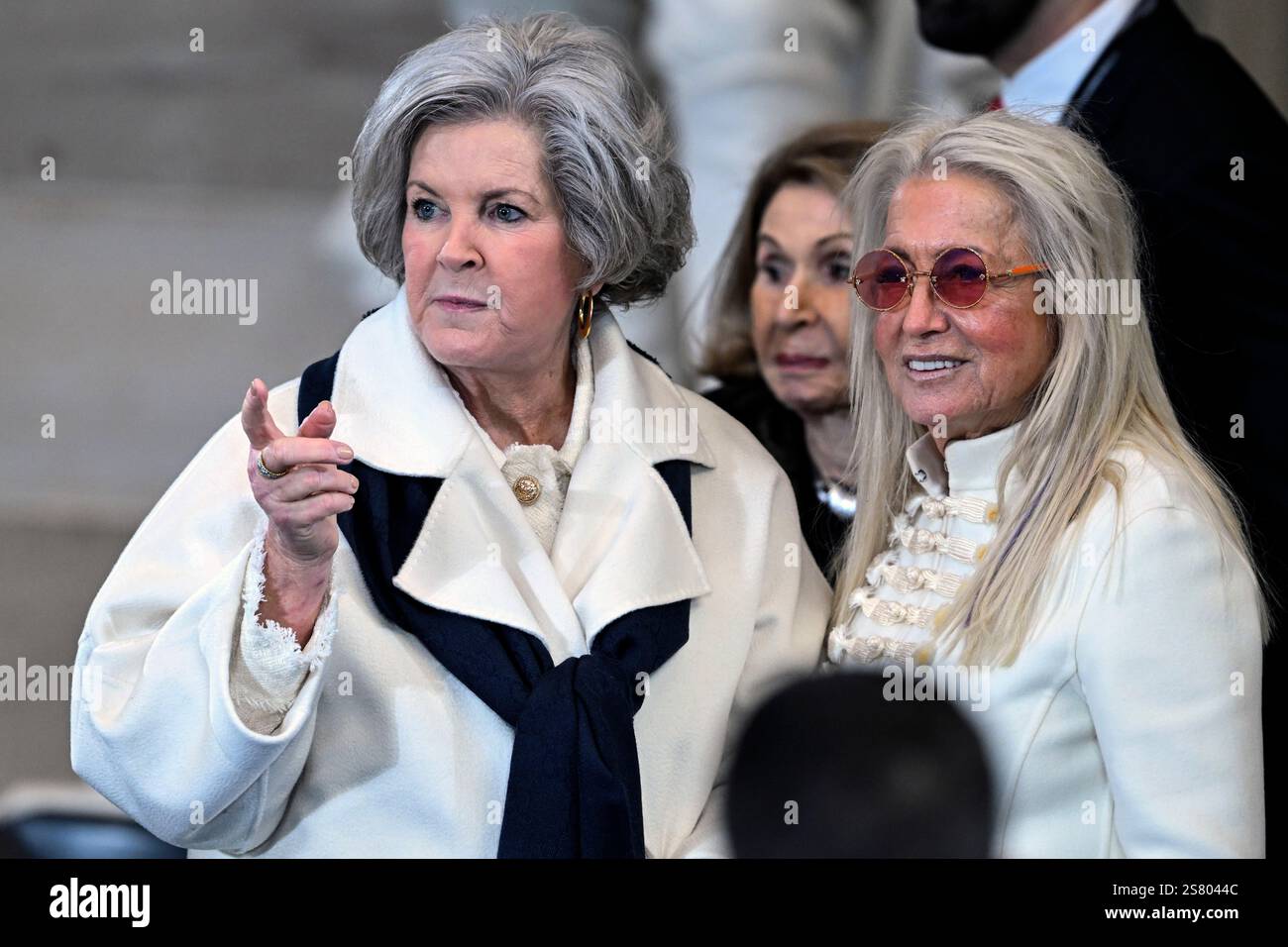 Incoming White House Chief of Staff Susie Wiles, left, speaks with ...