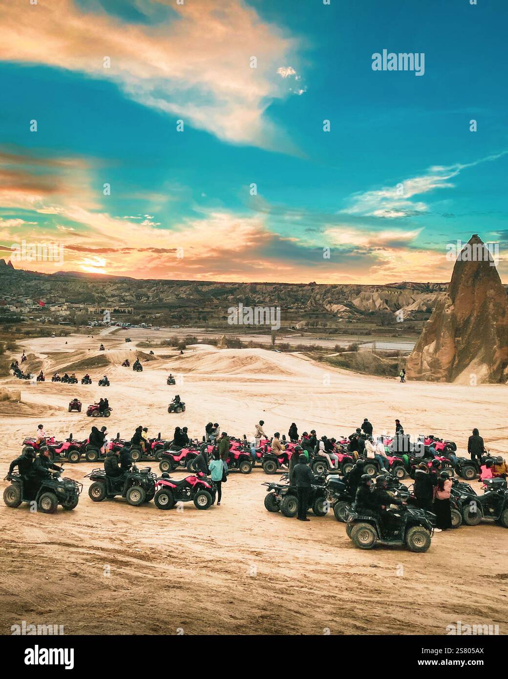 A group of people taking an ATV sunset tour around the valleys and ...
