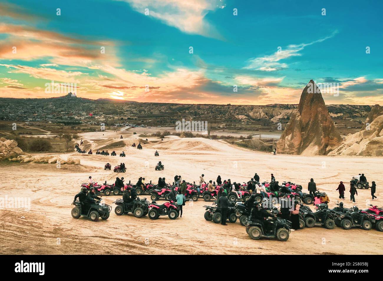 A group of people taking an ATV sunset tour around the valleys and ...