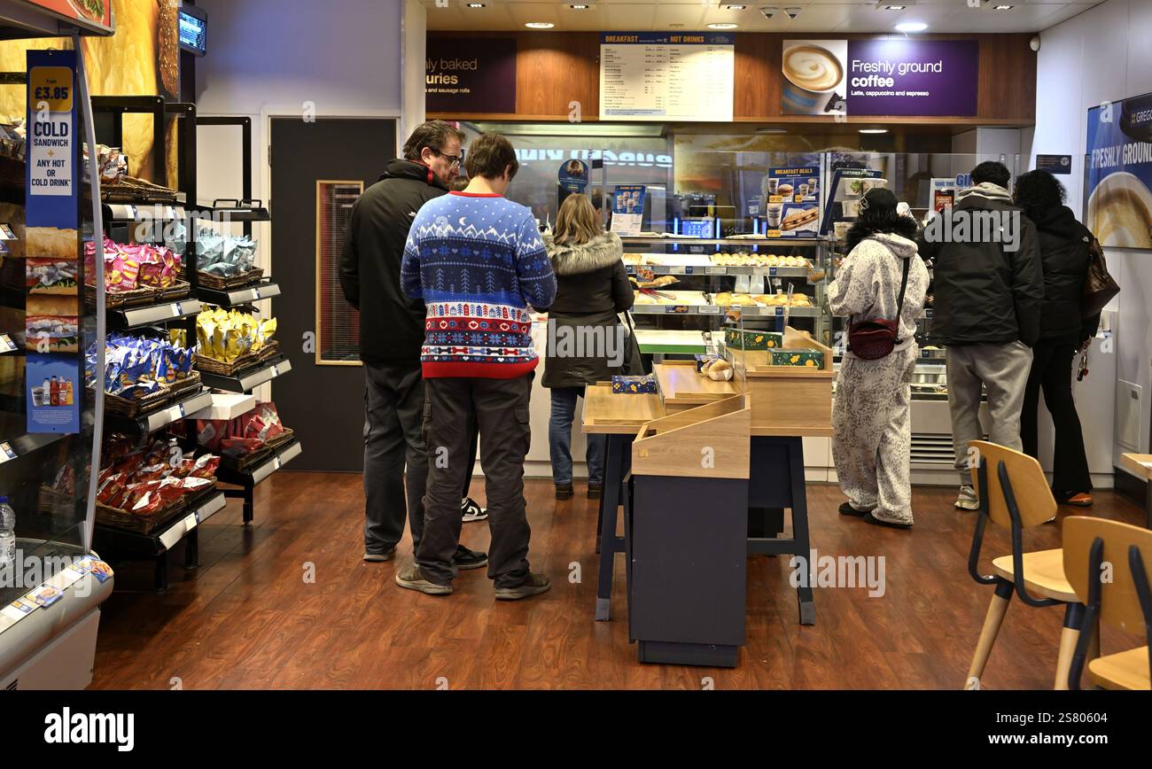 Customers queuing in line to order at Greggs the bakers fast food ...