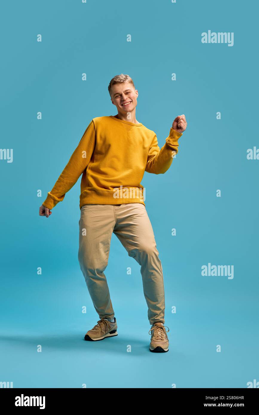 Dynamic, full body photo of young man, dressed stylish clothes, dancing ...
