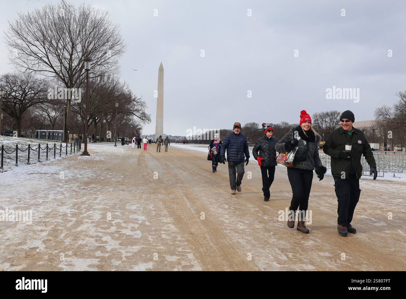 Trump supporters walk on the National Mall a few hours before President ...